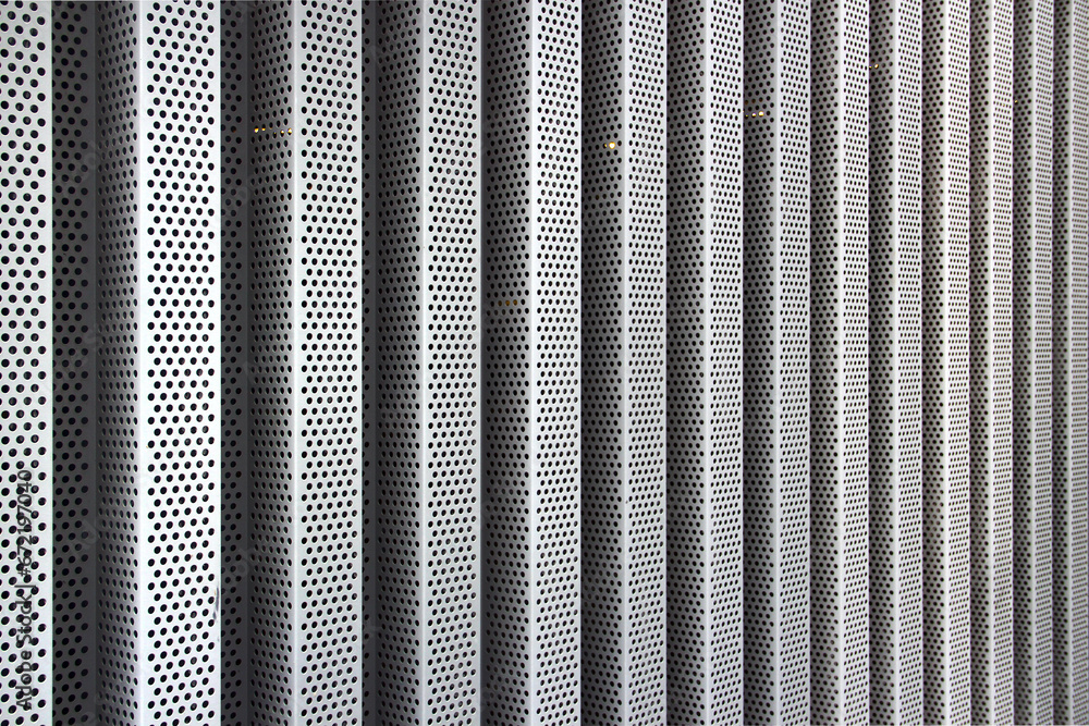 Perforated corrugated metal cladding sheet as background Stock Photo ...