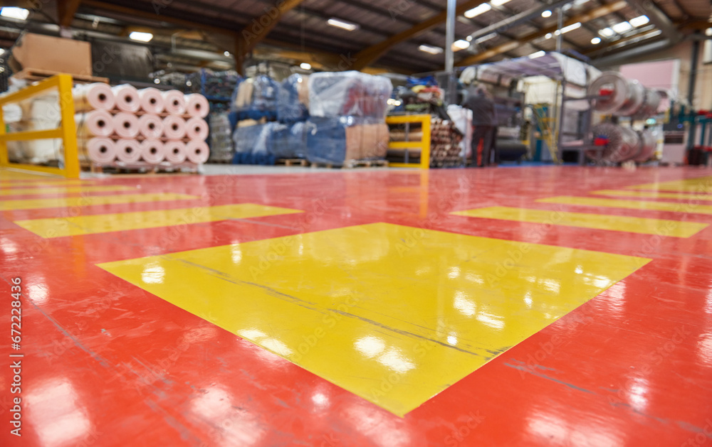 A high viz area floor sign protecting workers in an industrial factory ...