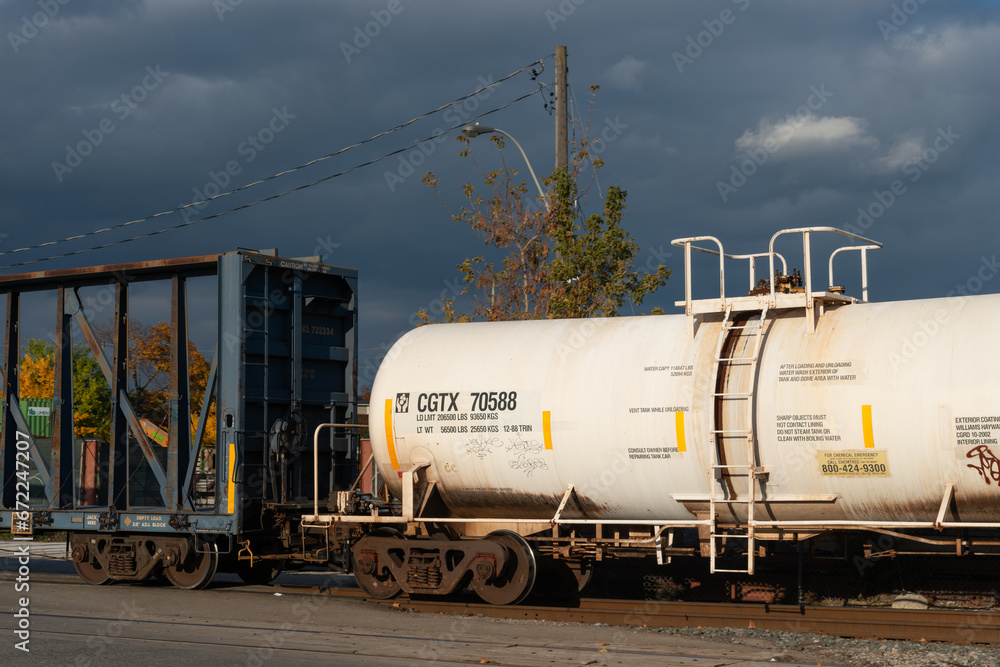train with centerbeam railcar and tanker with identification details ...