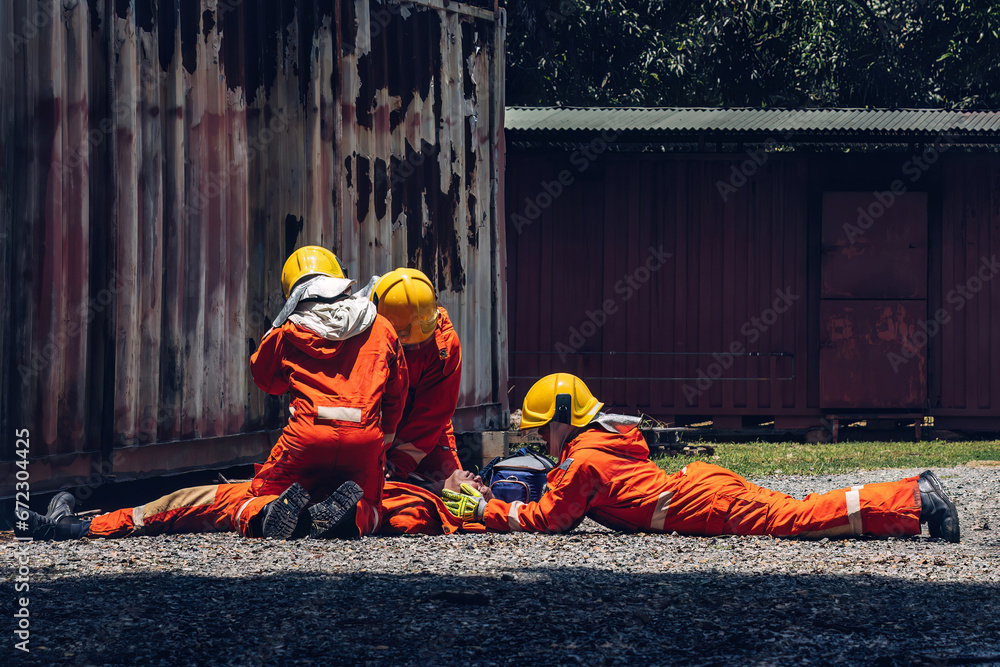First aid support accident at work. Firefighter to save girl in fire ...