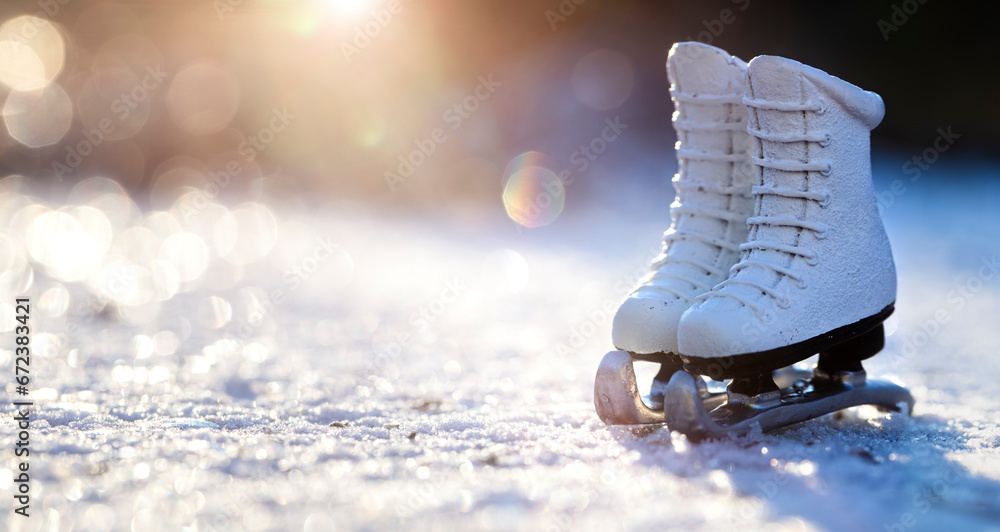Figure skates model on ice background ice skating concept Stock Photo ...