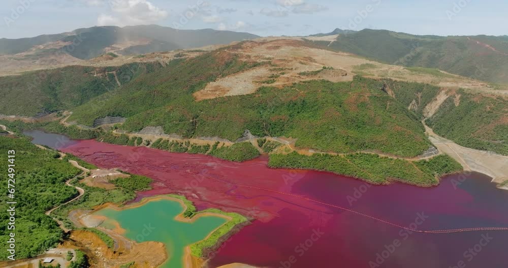 A lake with polluted water in a nickel mine. Mining in an open pit ...