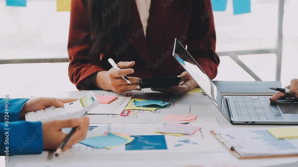 Two creative business people meeting and planning use post it notes ...