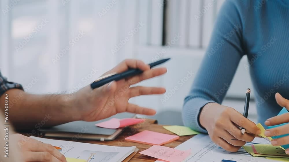 Two creative business people meeting and planning use post it notes ...