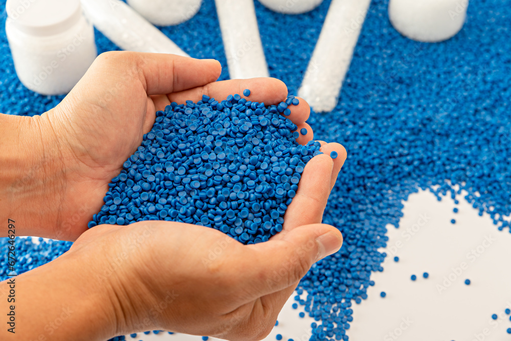 White plastic grain, plastic polymer granules,hand hold Polymer pellets ...