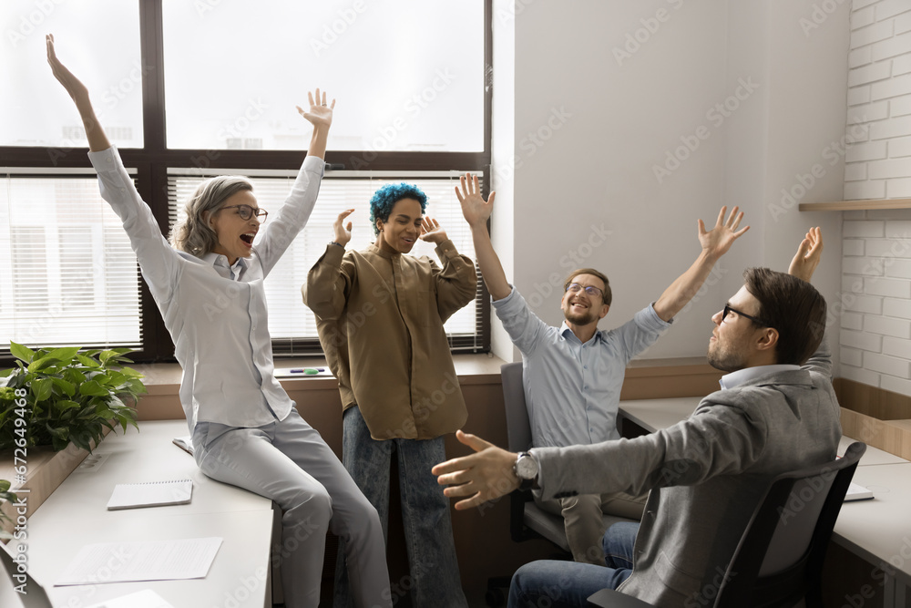 Cheerful excited small different aged diverse business team celebrating ...