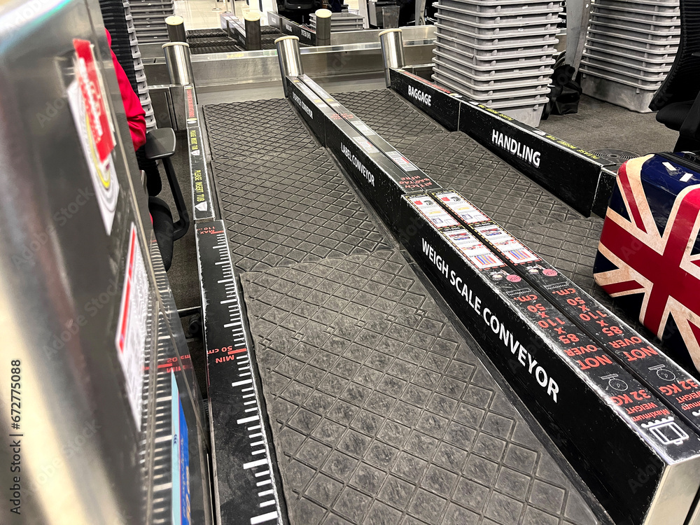 the weigh scale conveyor at the check in counter used to weight and ...