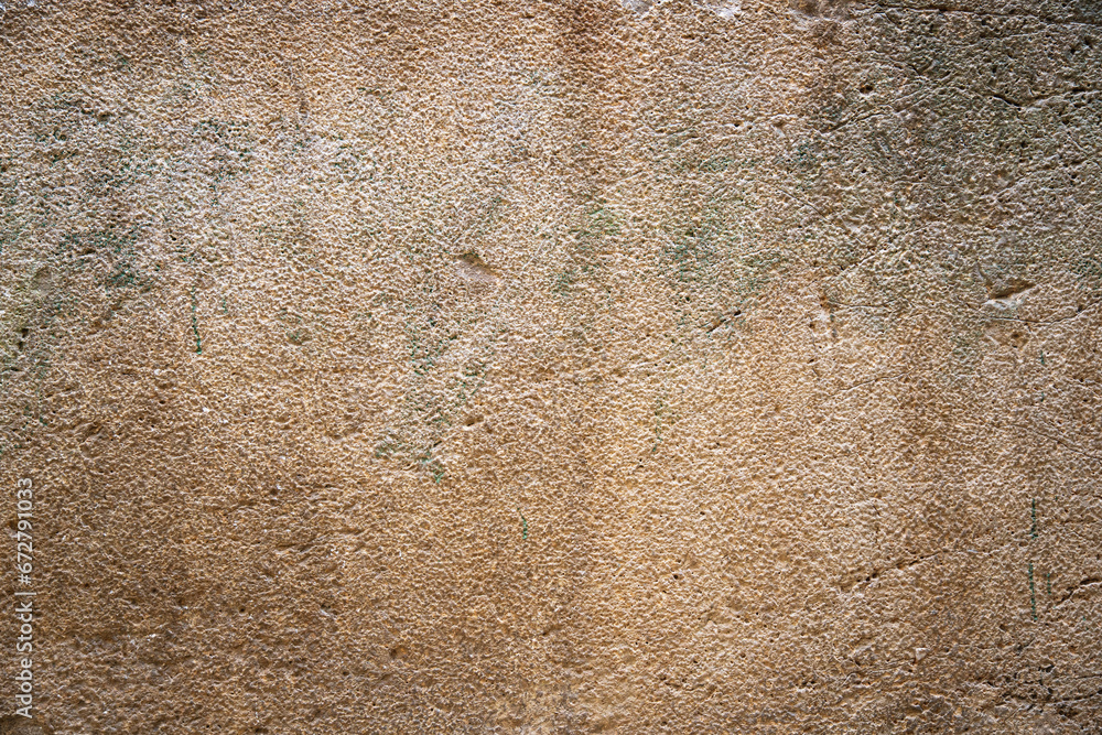 Texture of an ancient stone slab on the wall of the Cave of the ...