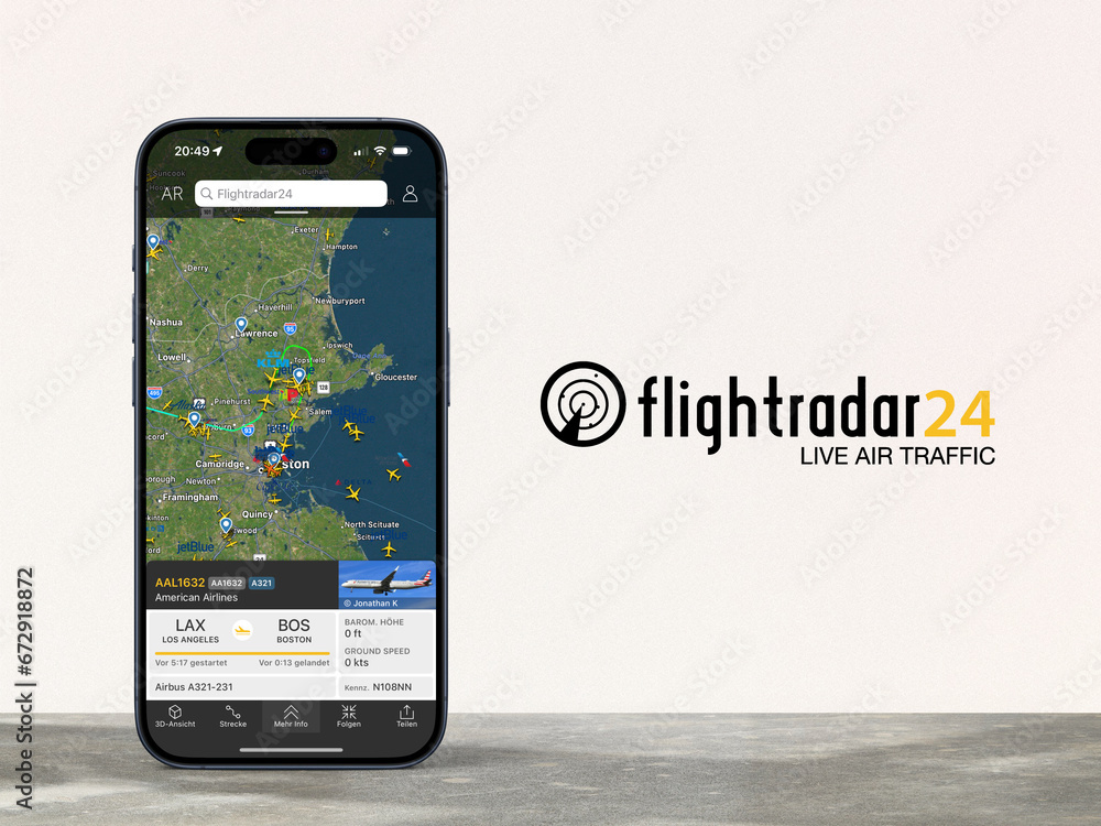 Flightradar24 logo is displayed on a modern smartphone, next to it is ...