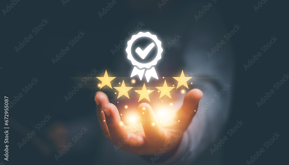 Quality assurance concept, Businessman holding and showing the best quality assurance with five ...