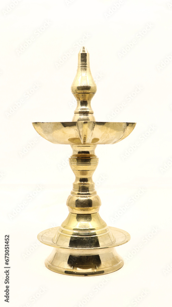 a vintage, brass oil lamp of unique traditional design used for temple ...