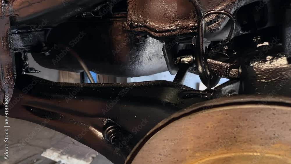 The result of anti-corrosion treatment of the underbody of a car. The ...