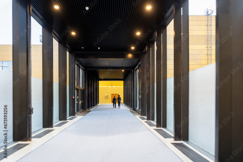 Long corridor with large windows. Transition between two industrial ...