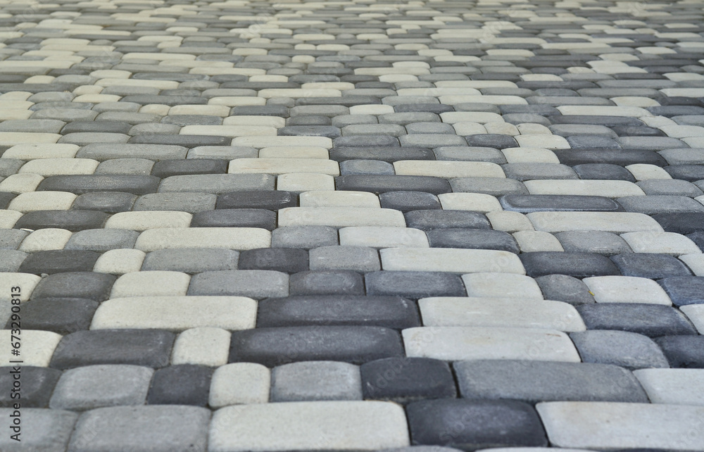 A detailed photo of the square, laid out of modern paving stone with ...