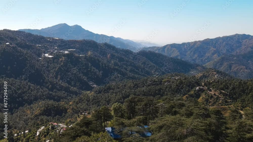 Aerial view of a Himalayan valley as seen to the horizon. Sunny clear ...