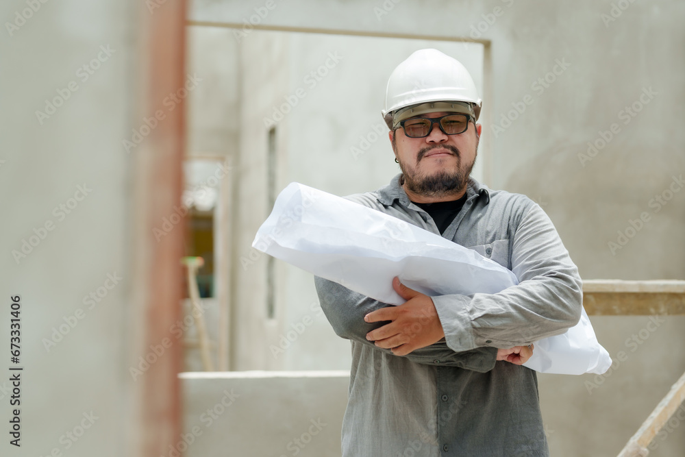 Asian male engineer construction worker Standing straight, holding ...