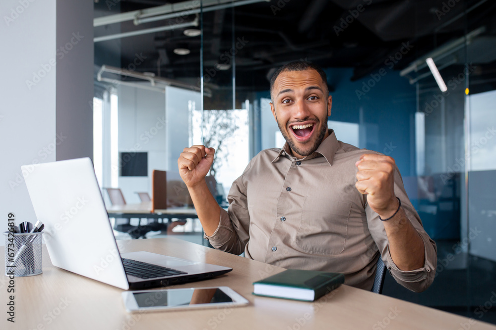 Successful Indian programmer celebrating successful completion of ...