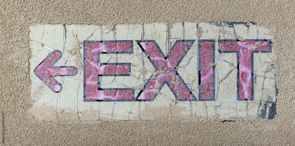 old faded EXIT sign affixed to stucco wall Stock Photo | Adobe Stock