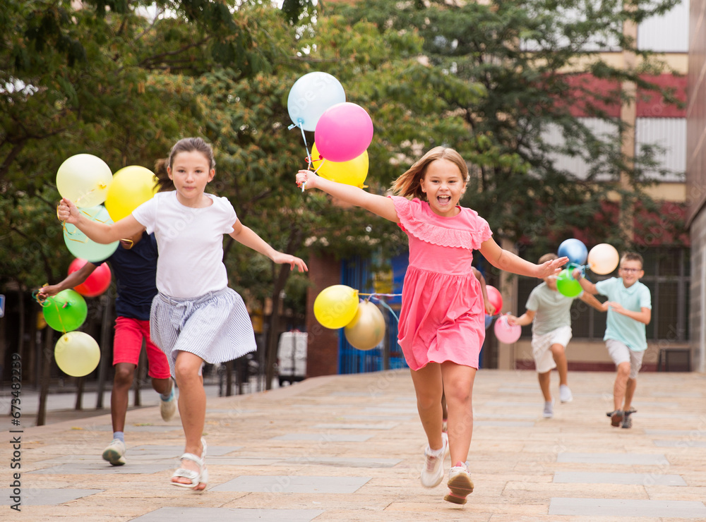 Happy tween friends of different nationalities having fun together on ...