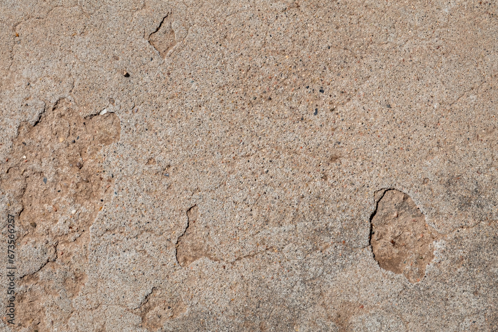 Macro image of a section of weathered concrete floor with cracks and ...