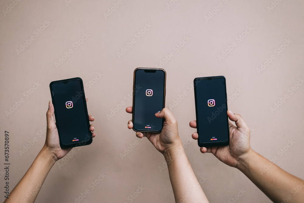 Bandung, Indonesia - 25 October 2023: Hands of people holding ...