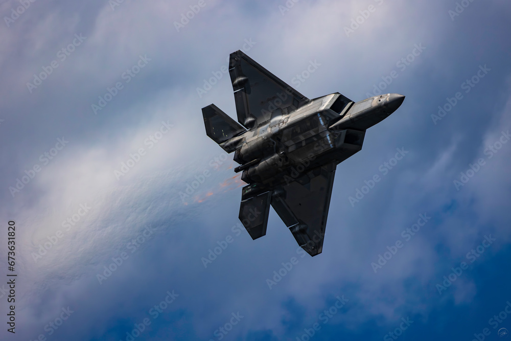 U.S. Air Force F-22 Raptor passes over head with afterburner and ...