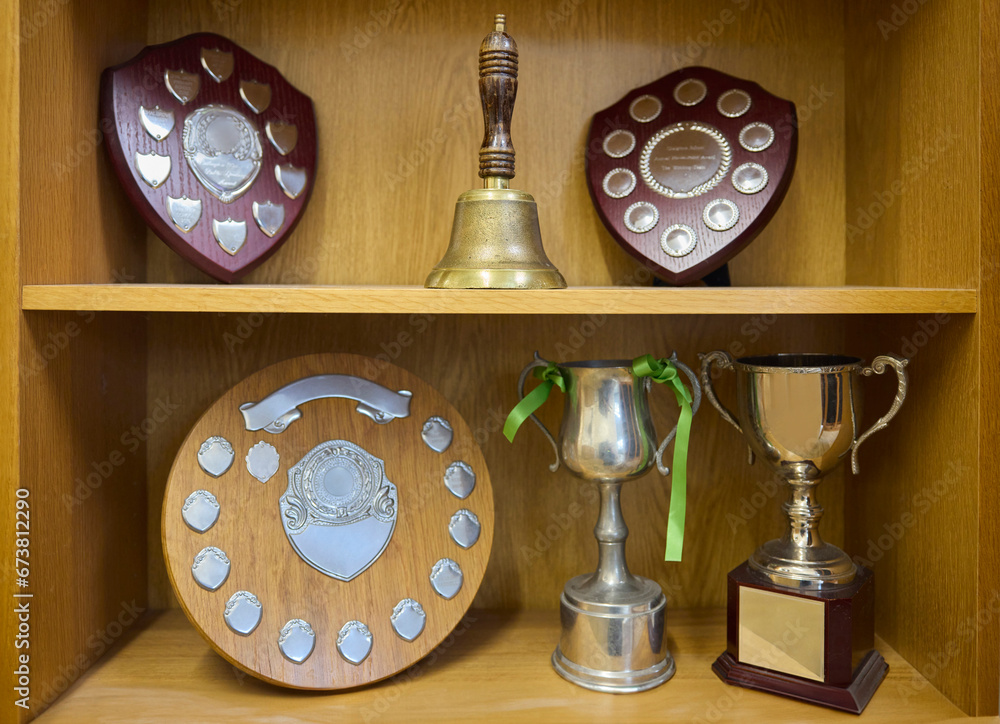 Trophies For Achievement On Display In Cabinet With Old Fashioned ...