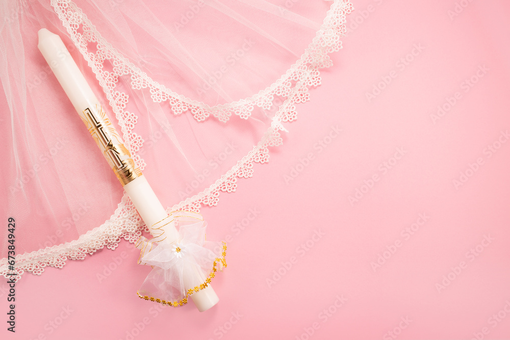 Christening background with baptism baby dress and candle on pink ...