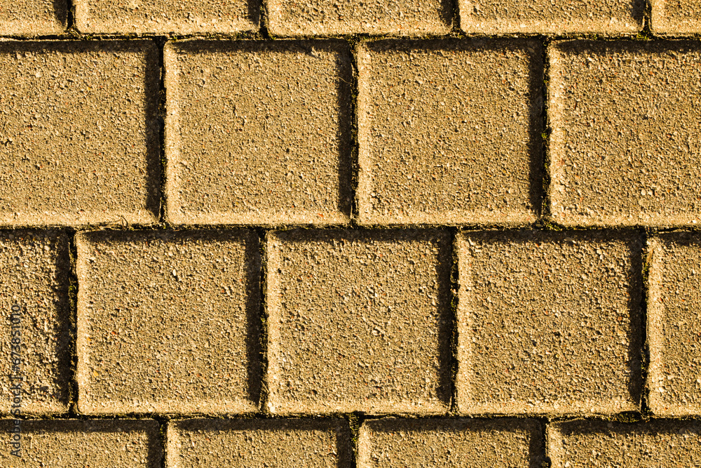 Cobblestone pavement. Square shape bricks. Gray walking path. Paved ...