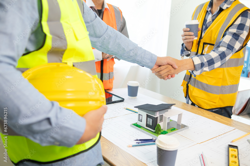 Architects and construction engineering handshake after meeting discuss ...