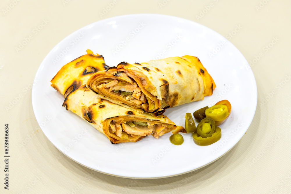 Lavash doner kebab ( zurna doner durum ) or shawarma sliced in plate ...