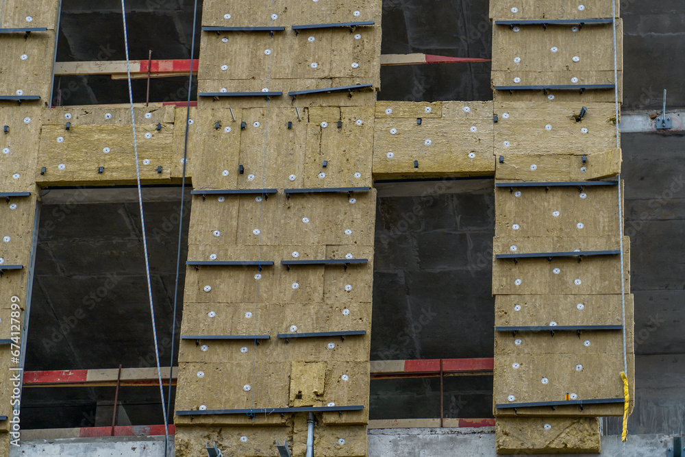 Installation of external wall thermal insulation with rock wool ...
