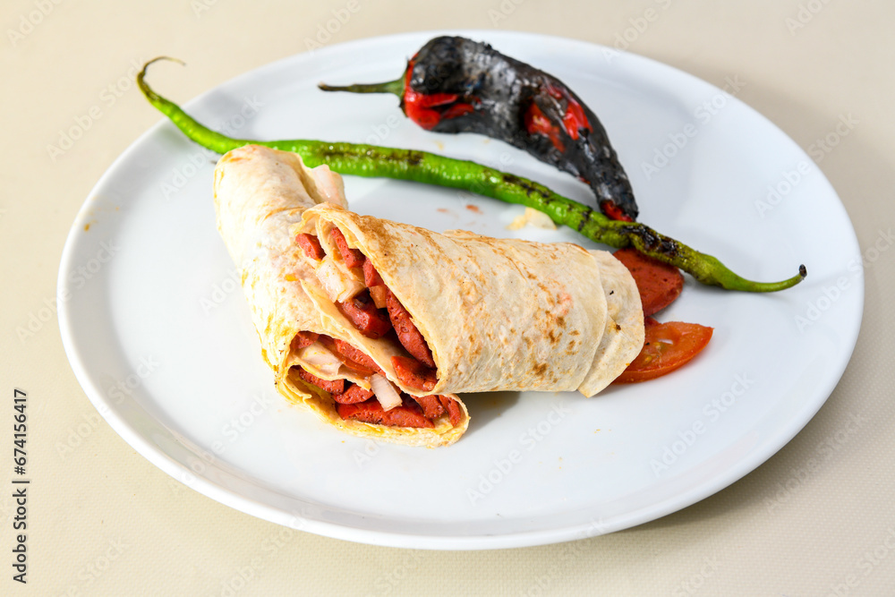 Lavash doner kebab ( zurna doner durum ) or shawarma sliced in plate ...