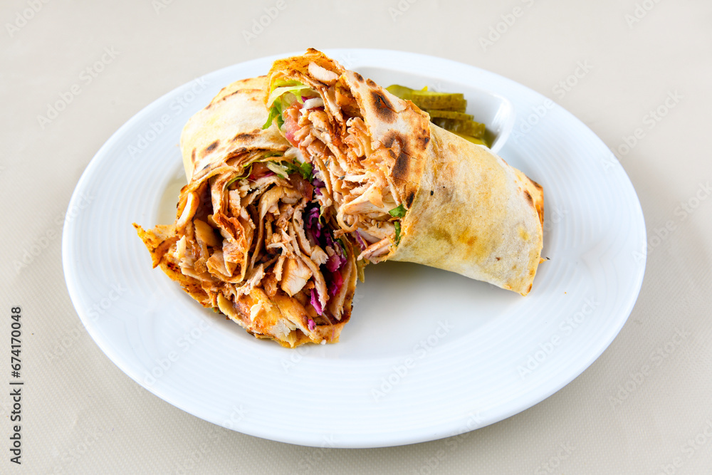 Lavash doner kebab ( zurna doner durum ) or shawarma sliced in plate ...