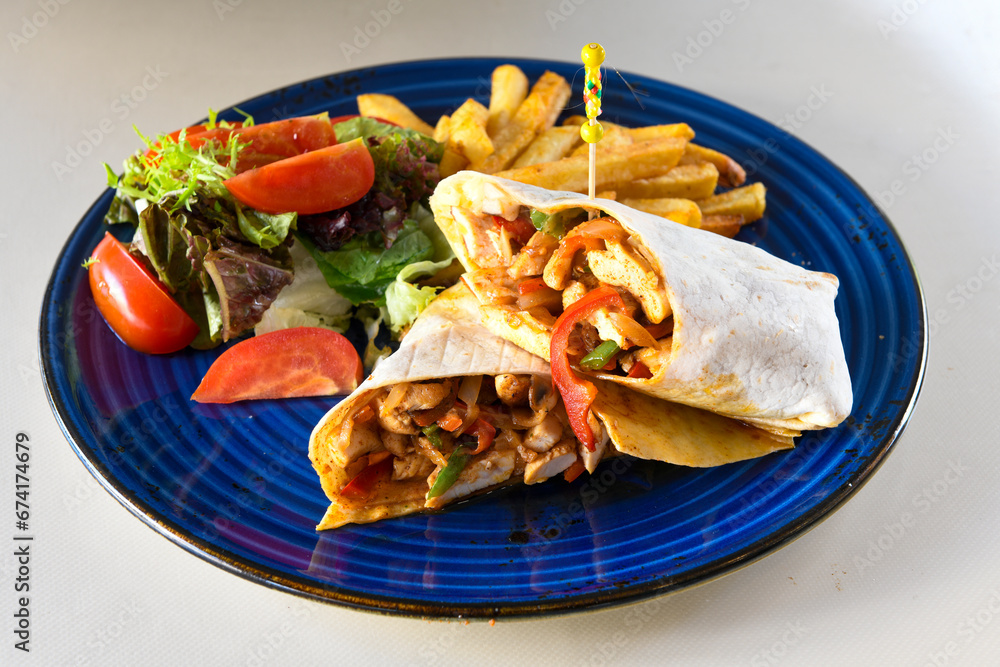 Lavash doner kebab ( zurna doner durum ) or shawarma sliced in plate ...