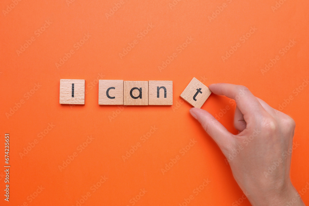 Motivation concept. Woman changing phrase from I Can't into I Can by ...