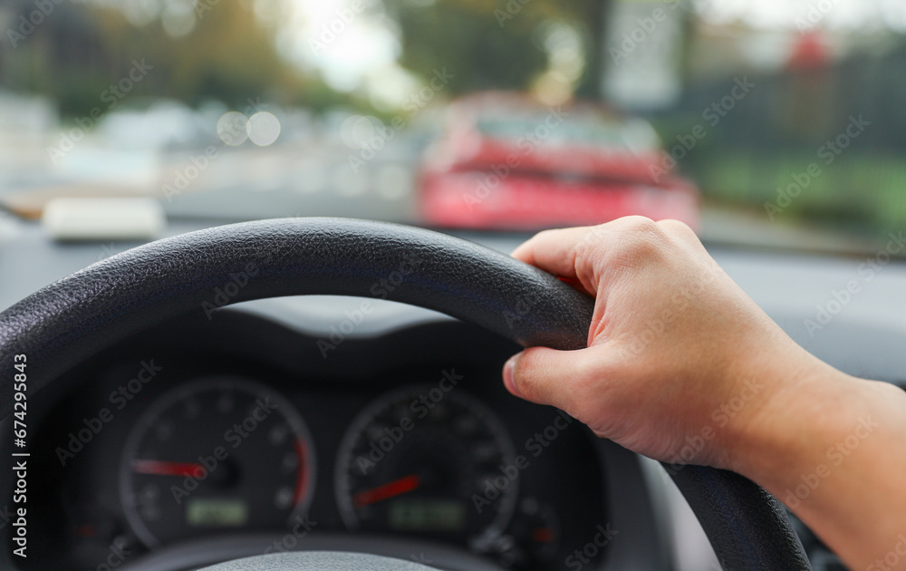 hands gripping a steering wheel, symbolizing control, focus, and safety ...