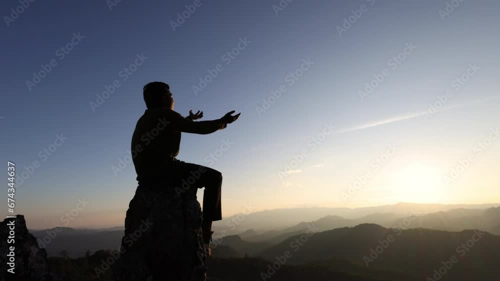 man rise hand up on top of mountain and sunset sky abstract background ...