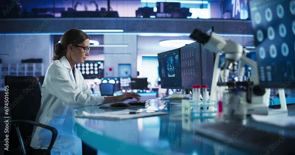 Caucasian Female Neuroscientist Using Desktop Computer To Analyze CT Scans Of Human Brain In ...