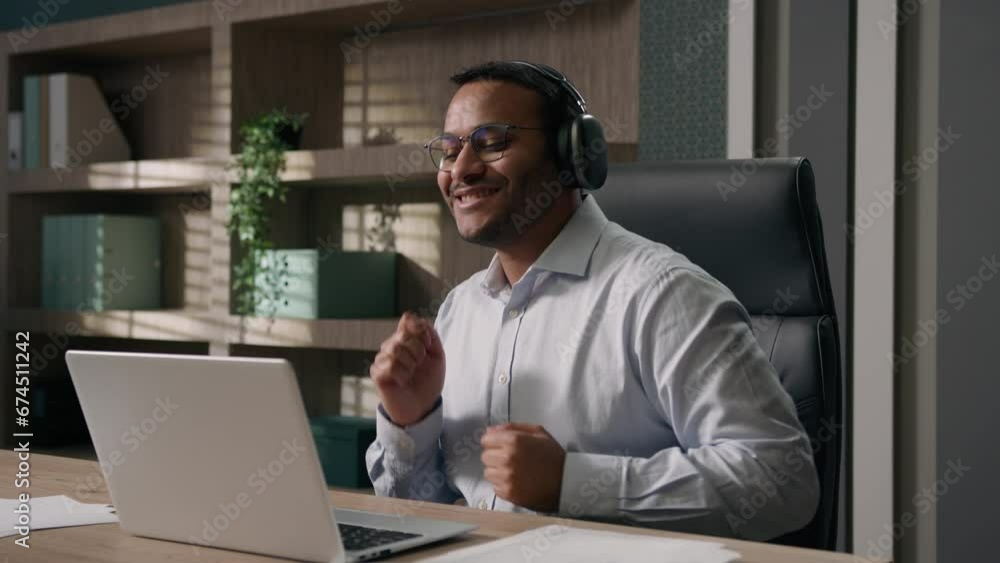 Happy employer at office table with computer laptop enjoying rest break ...