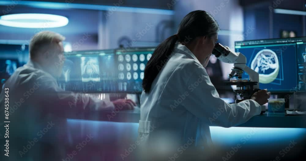 Female Asian Scientist Using Microscope To Analyze Petri Dish Sample In ...