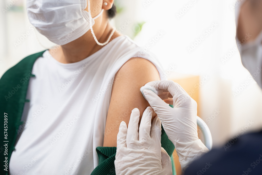 People getting a vaccination to prevent pandemic concept. Mature Woman ...