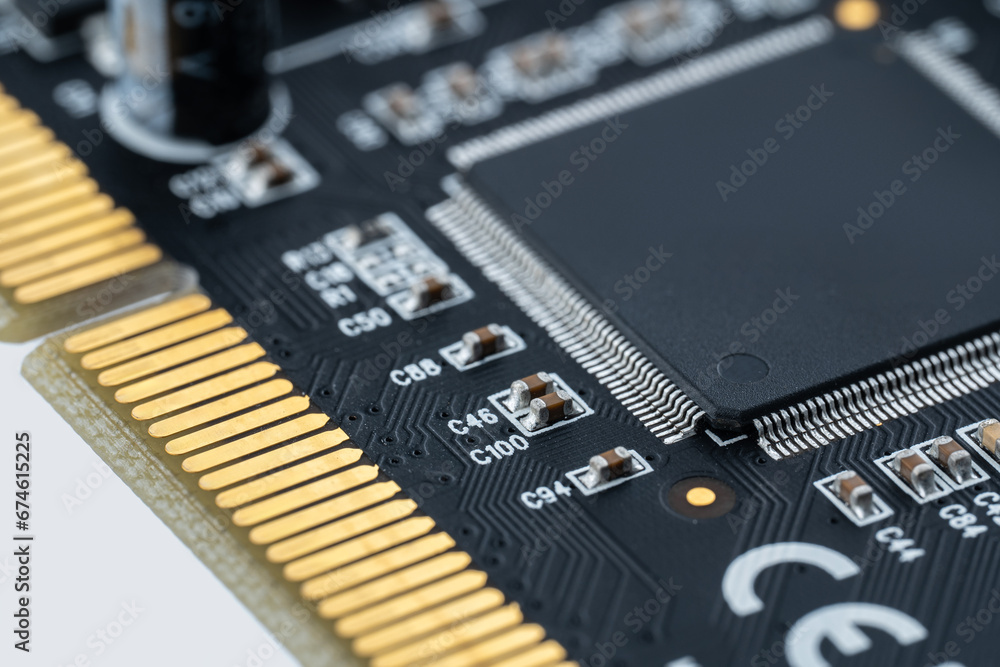 Circuit board macro shot reveals small chip sand SMD capacitors ...