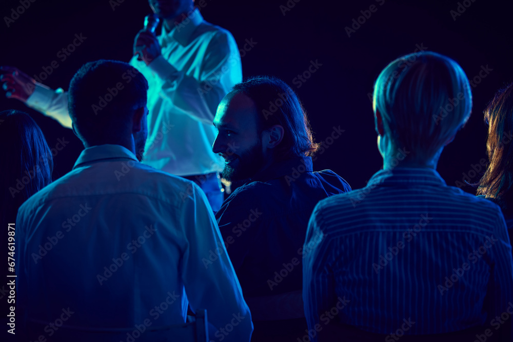 Group of of different people attending concert, stand up show ...