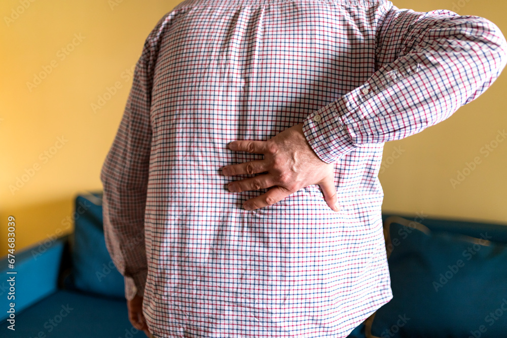 Man Is Touching His Back Because It Aches. Backache Concept Bending ...