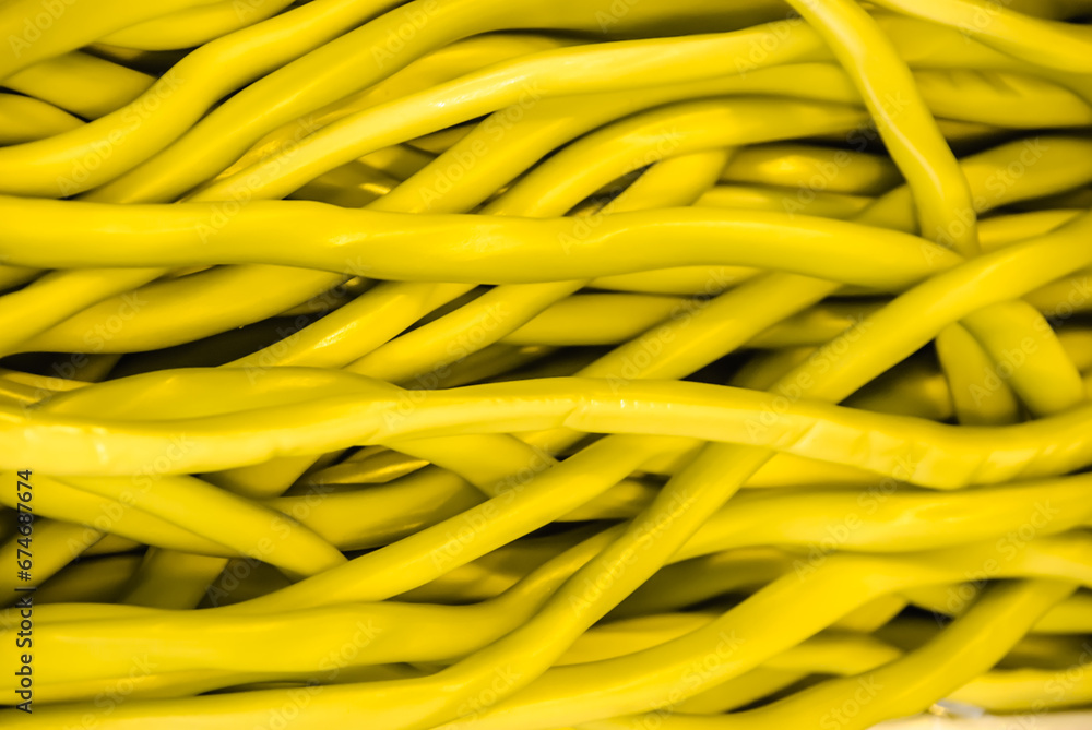 Pile of yellow ethernet network cables that look like yellow string ...
