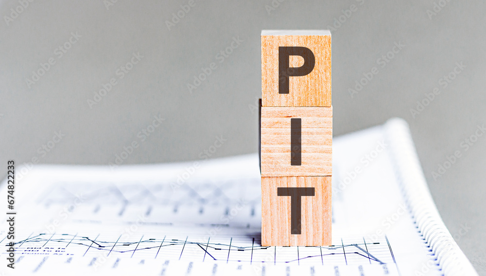 text PIT - Personal Income Tax - acronym concept on cubes and diagrams ...