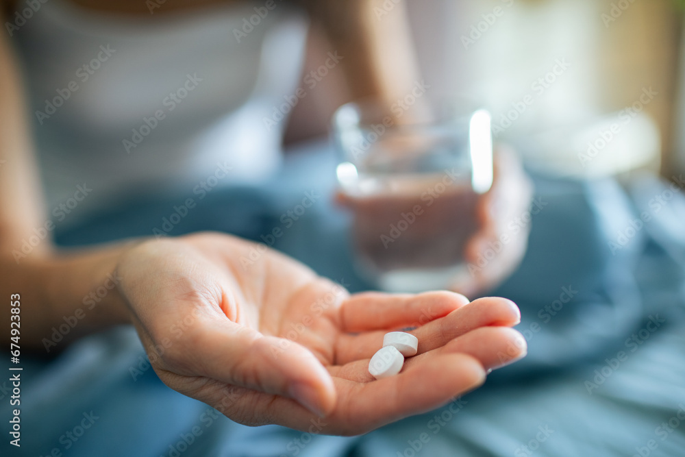 Close up of hand with two pills Stock Photo | Adobe Stock