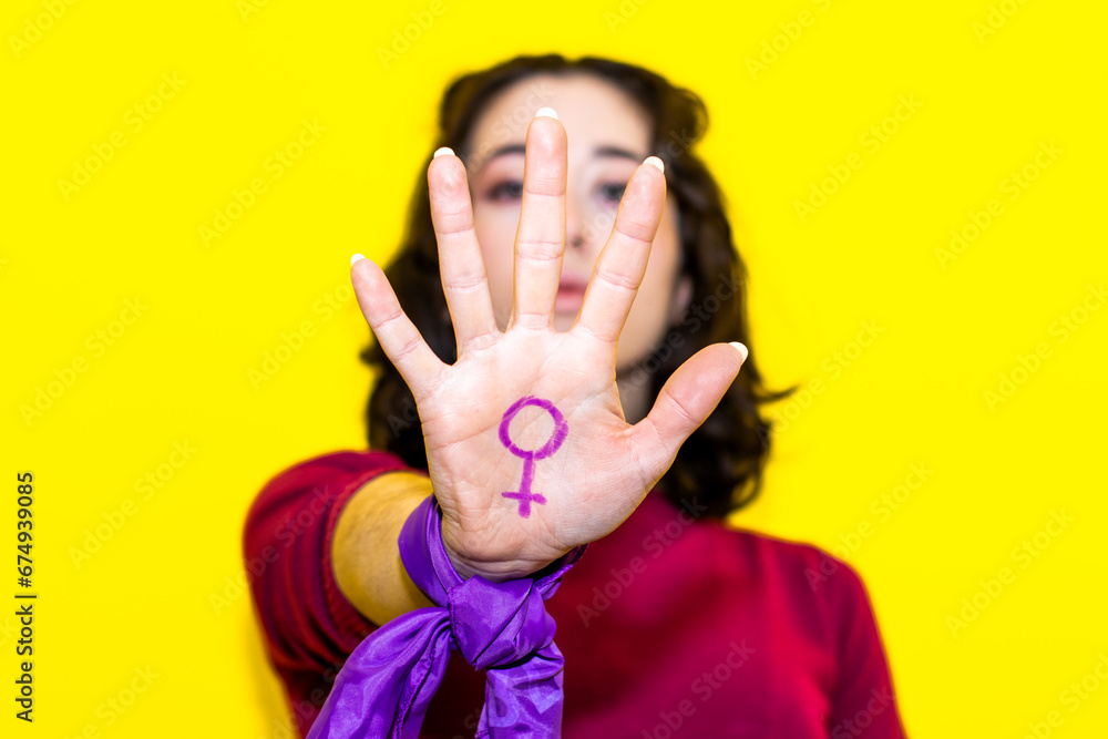Serious woman showing the palm of her hand with the drawing of the ...