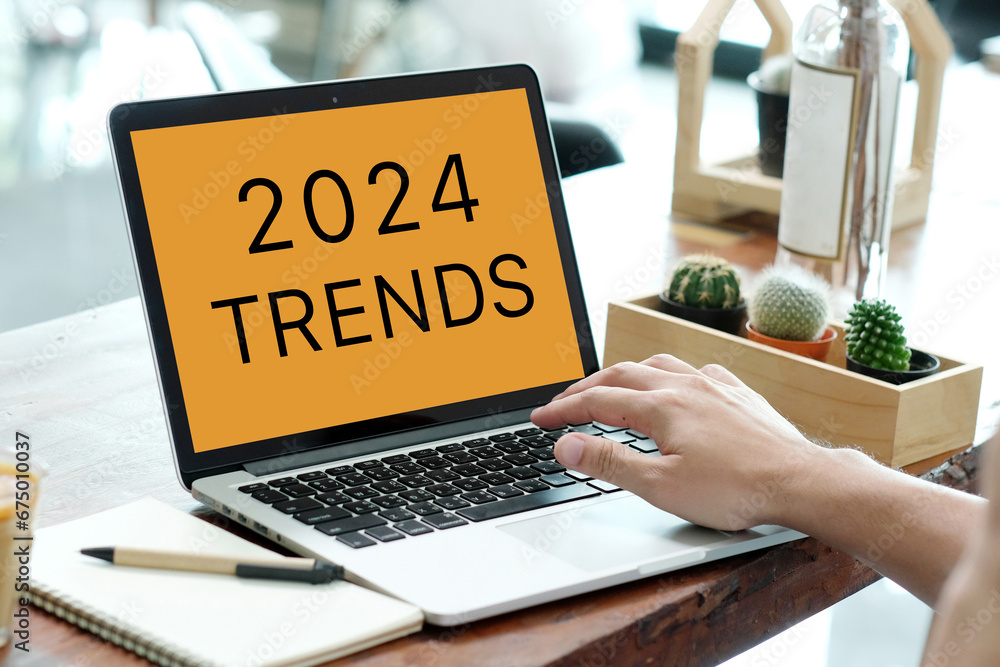 Laptop computer with 2024 trends on screen background, digital ...